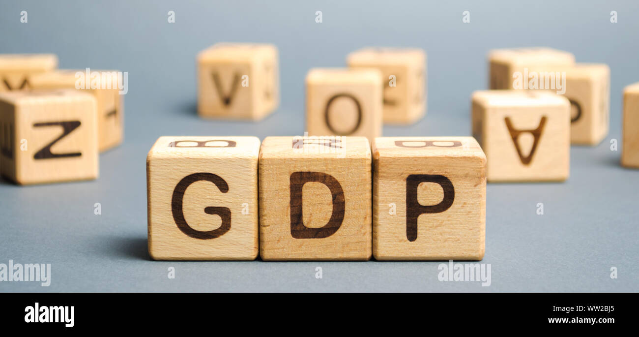 Wooden blocks with the word GDP ( Gross domestic product ). Financial ...