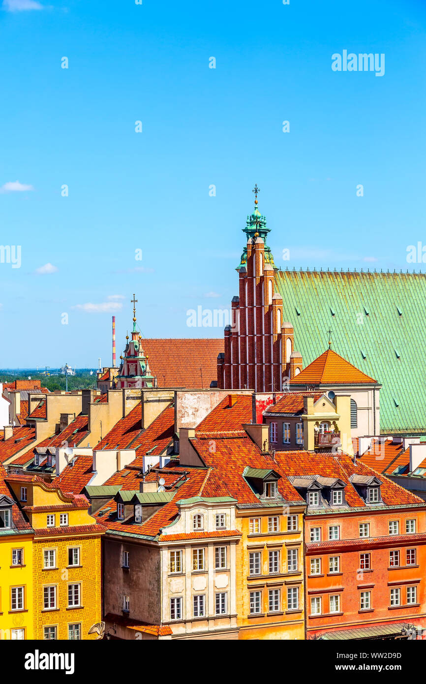 Warsaw, Poland colorful houses and towers in Castle Square in the Old ...