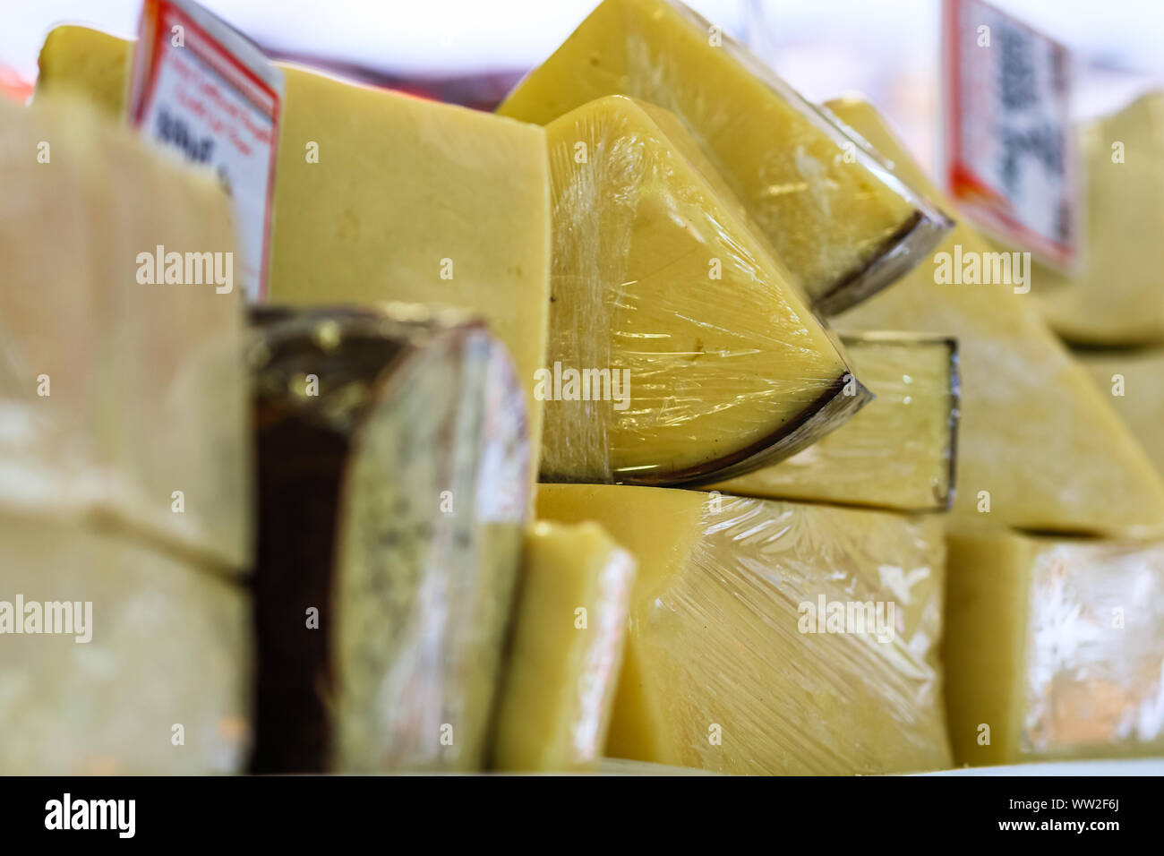Close up photo of cheese ready for sale at a local street foot festival ...