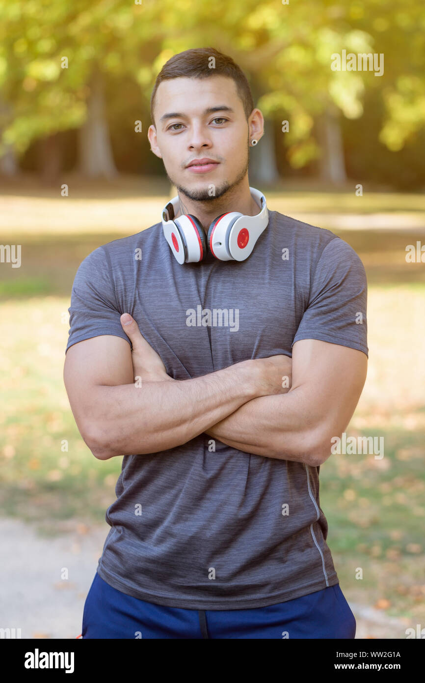 Young latin man runner running jogging sports training fitness workout ...