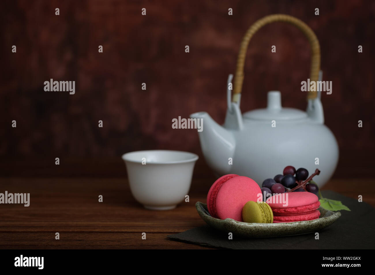Still life macaroon dessert for ceramic dish on rustic wooden table ...