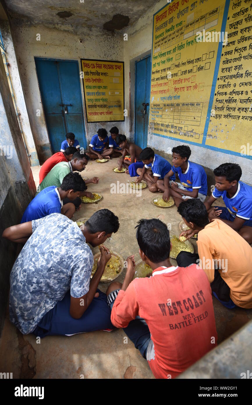 Village footballers taking lunch between a tournament at a primary ...