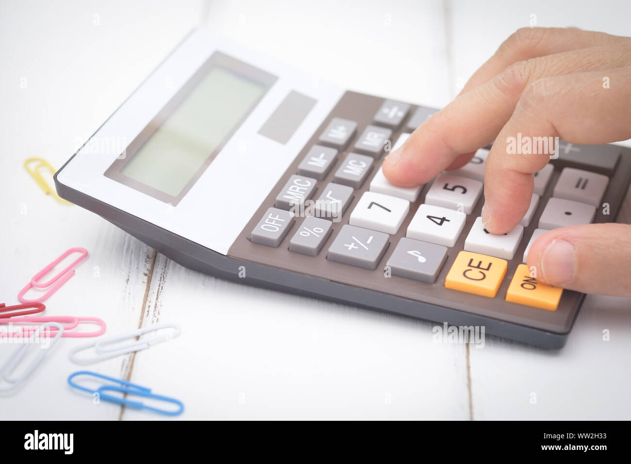 businesswoman using a calculator on desk, Choose focus point Stock ...