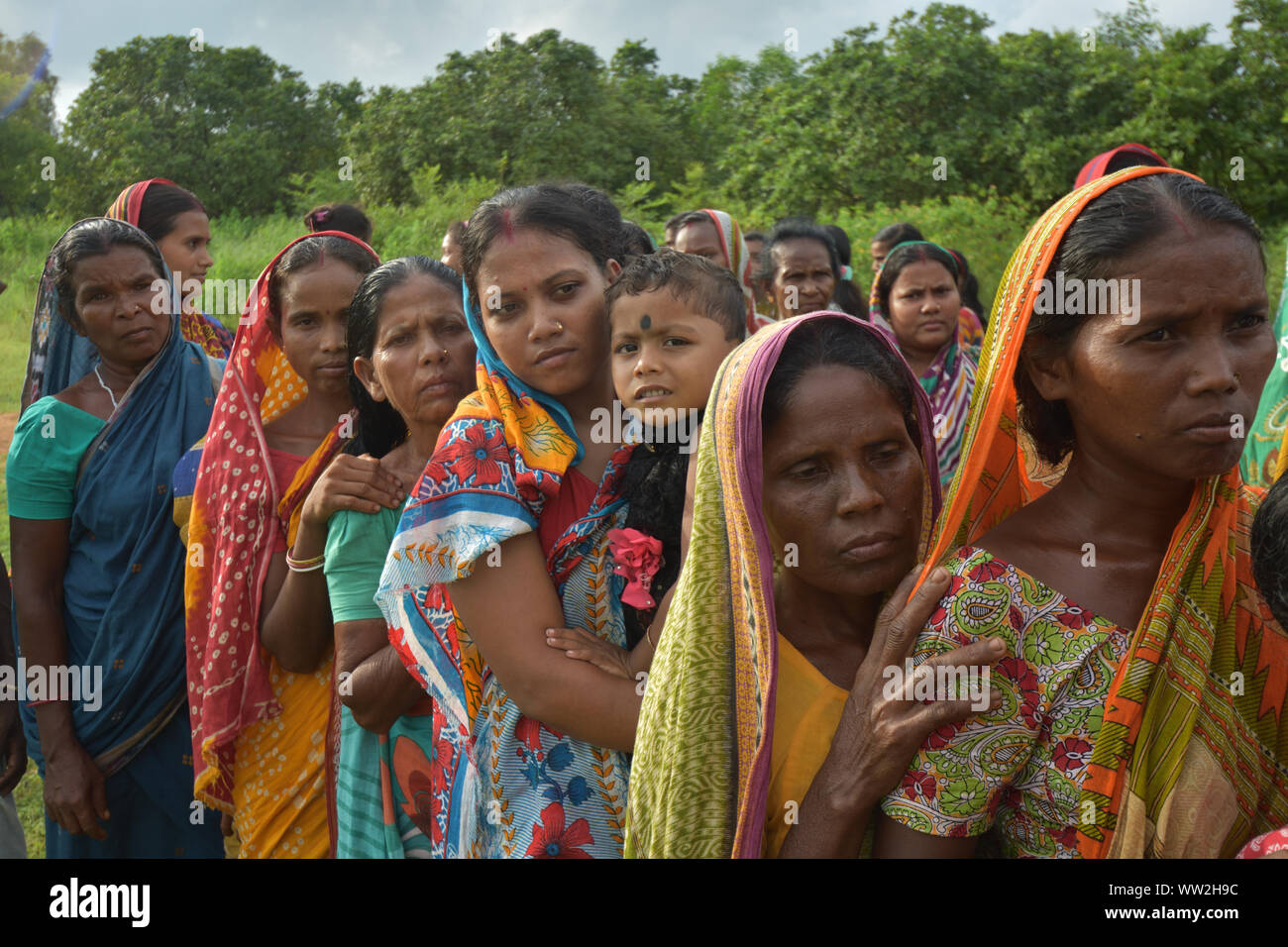Village women stand in queue hi-res stock photography and images - Alamy