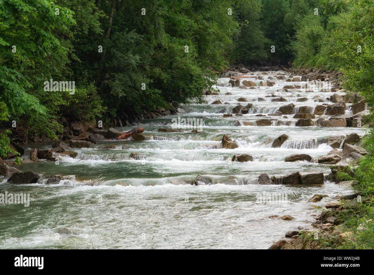 Mountain river Fuscher Ache with stepped riffles, Austria Stock Photo ...
