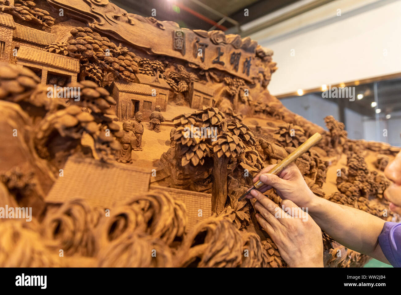 A Chinese craftsman carves the scenes shown in the ancient Chinese ...