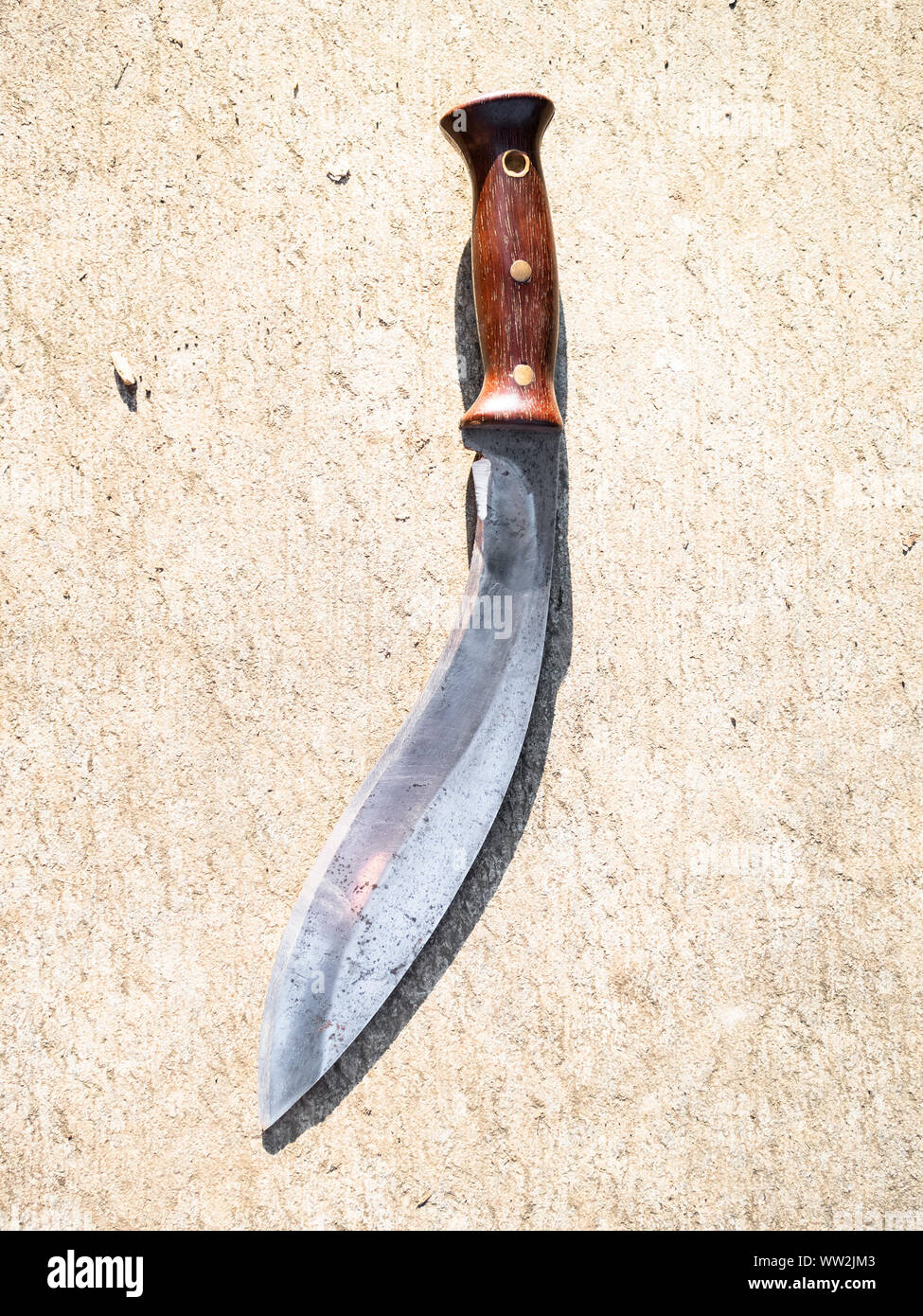 top view of Khukuri traditional Nepali knife on outdoor concrete board ...