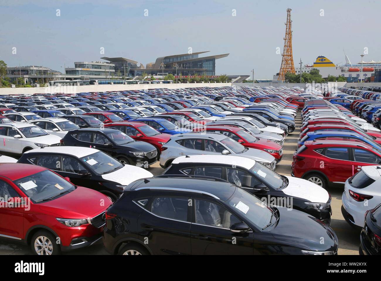 Domestically-manufactured cars to be exported are lined up in a ...
