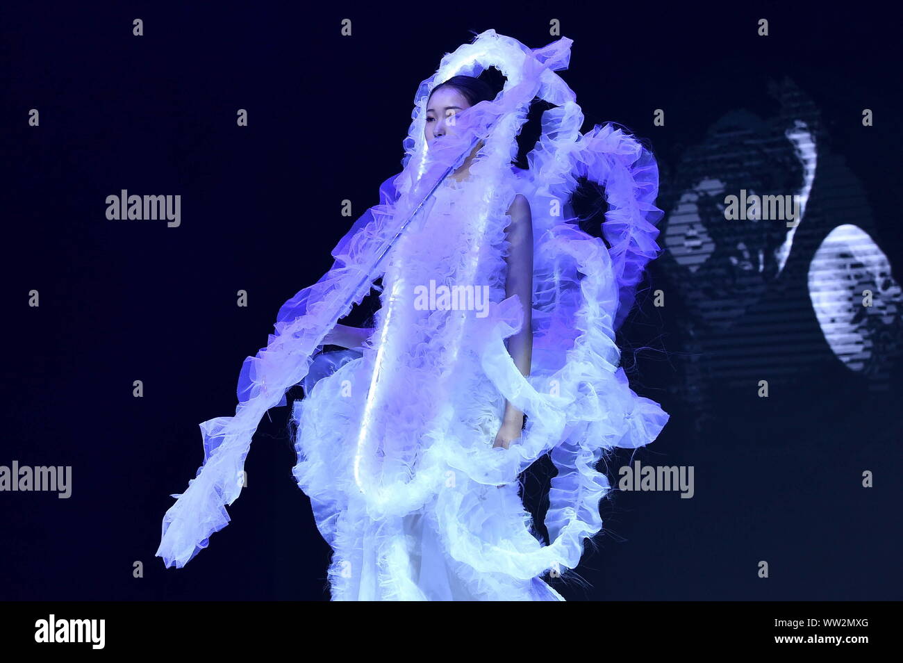 A model shows a new creation by Chinese designer Yao Feng during his ...