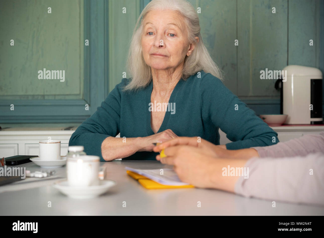 Sad patient sitting in clinic Stock Photo - Alamy