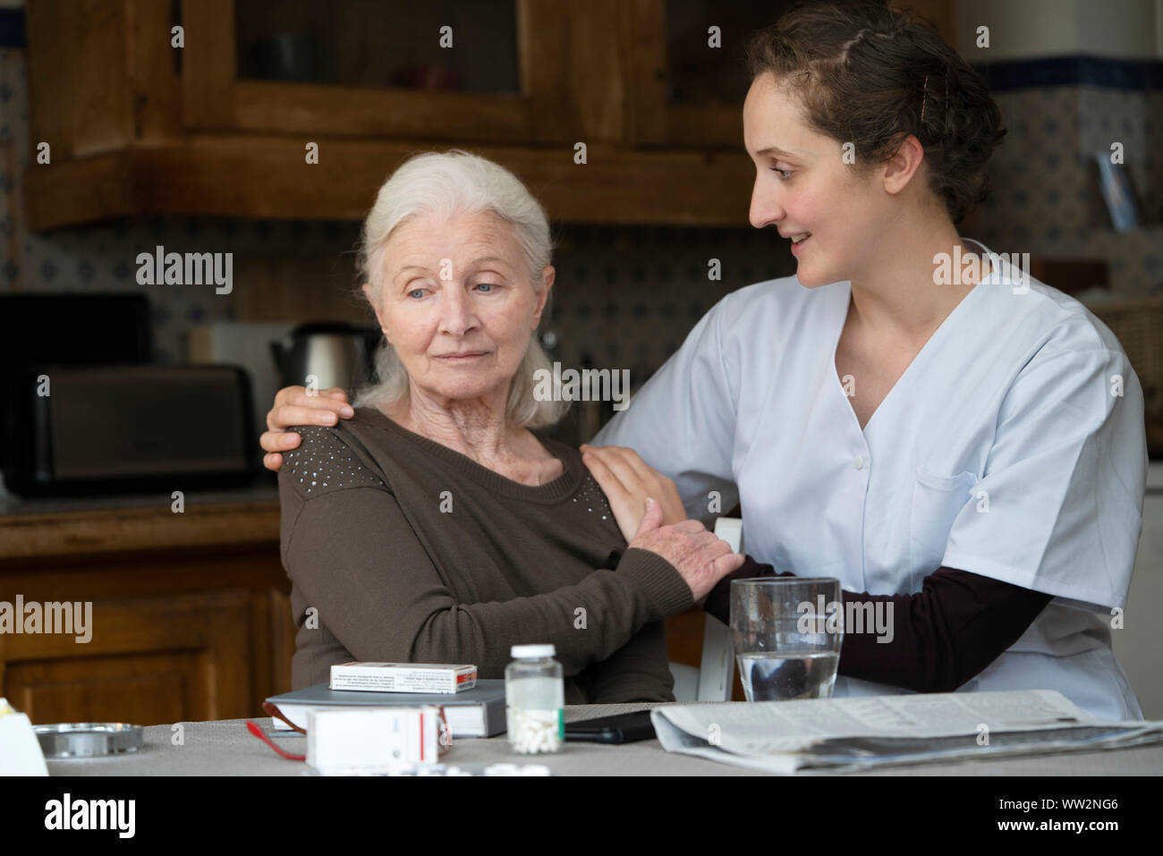 Nurse consoling patient Stock Photo - Alamy