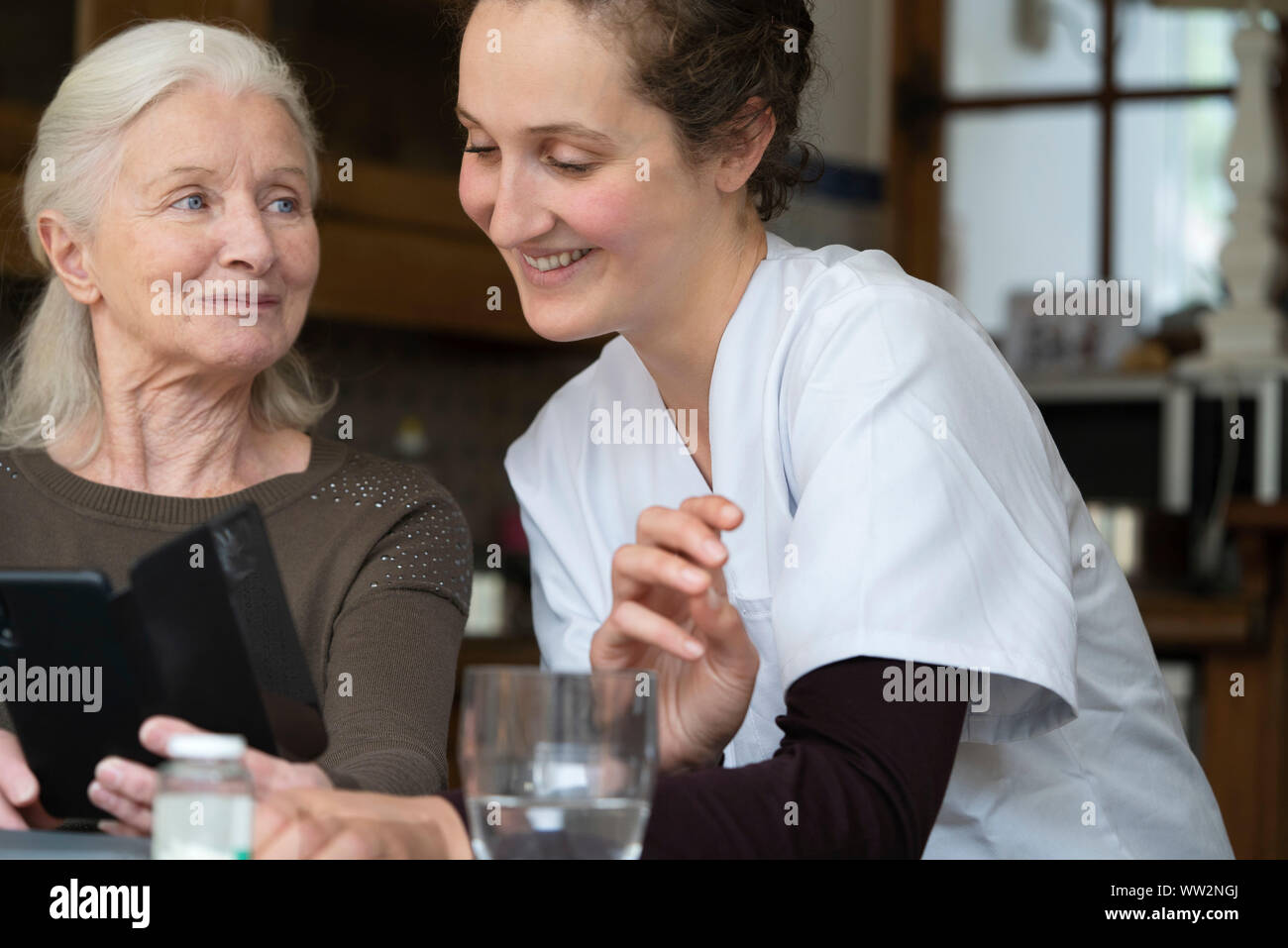 Senior female patient using mobile hi-res stock photography and images ...