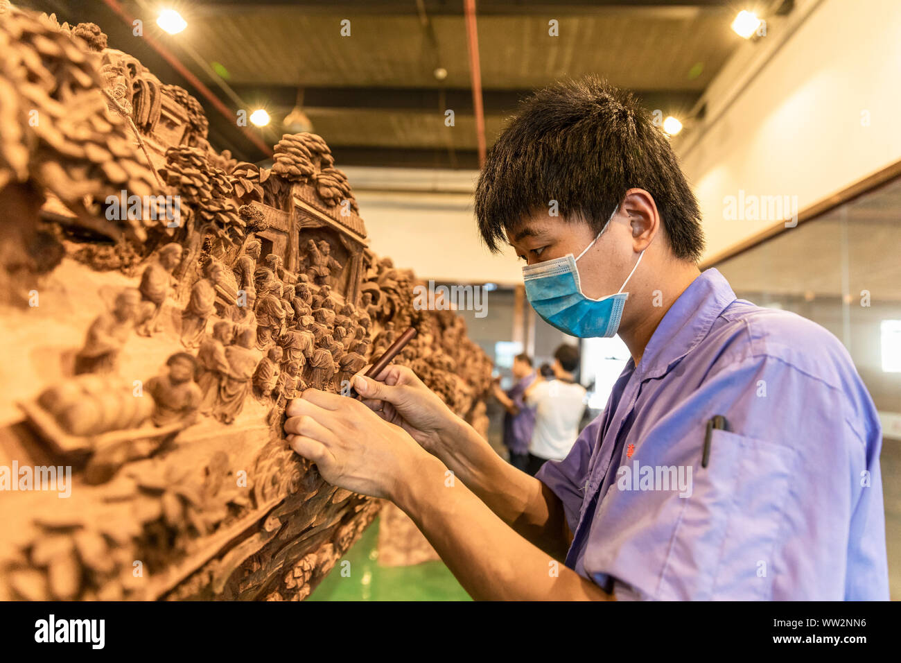A Chinese craftsman carves the scenes shown in the ancient Chinese ...