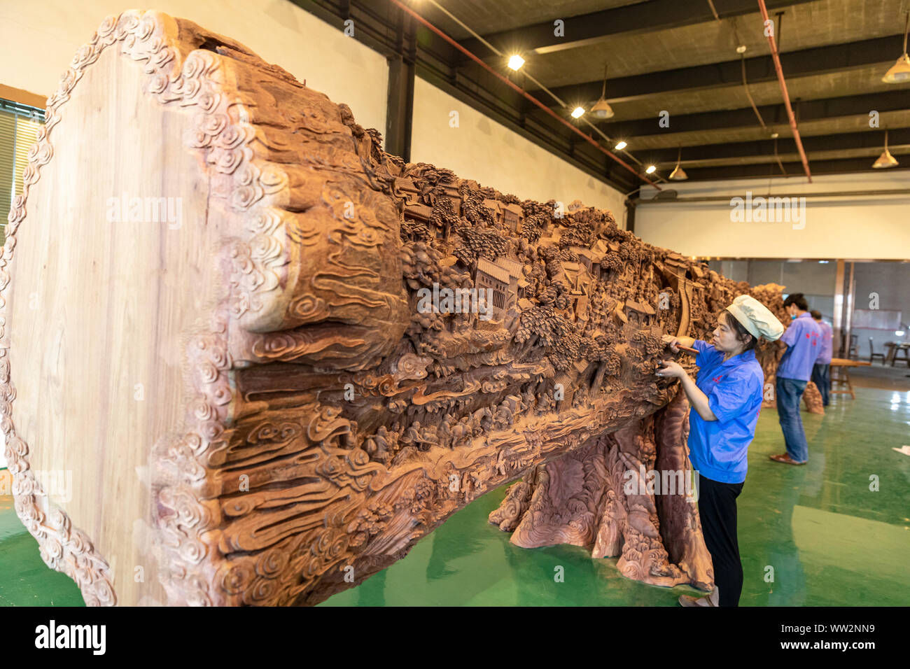 Chinese craftsmen carve the scenes shown in the ancient Chinese ...