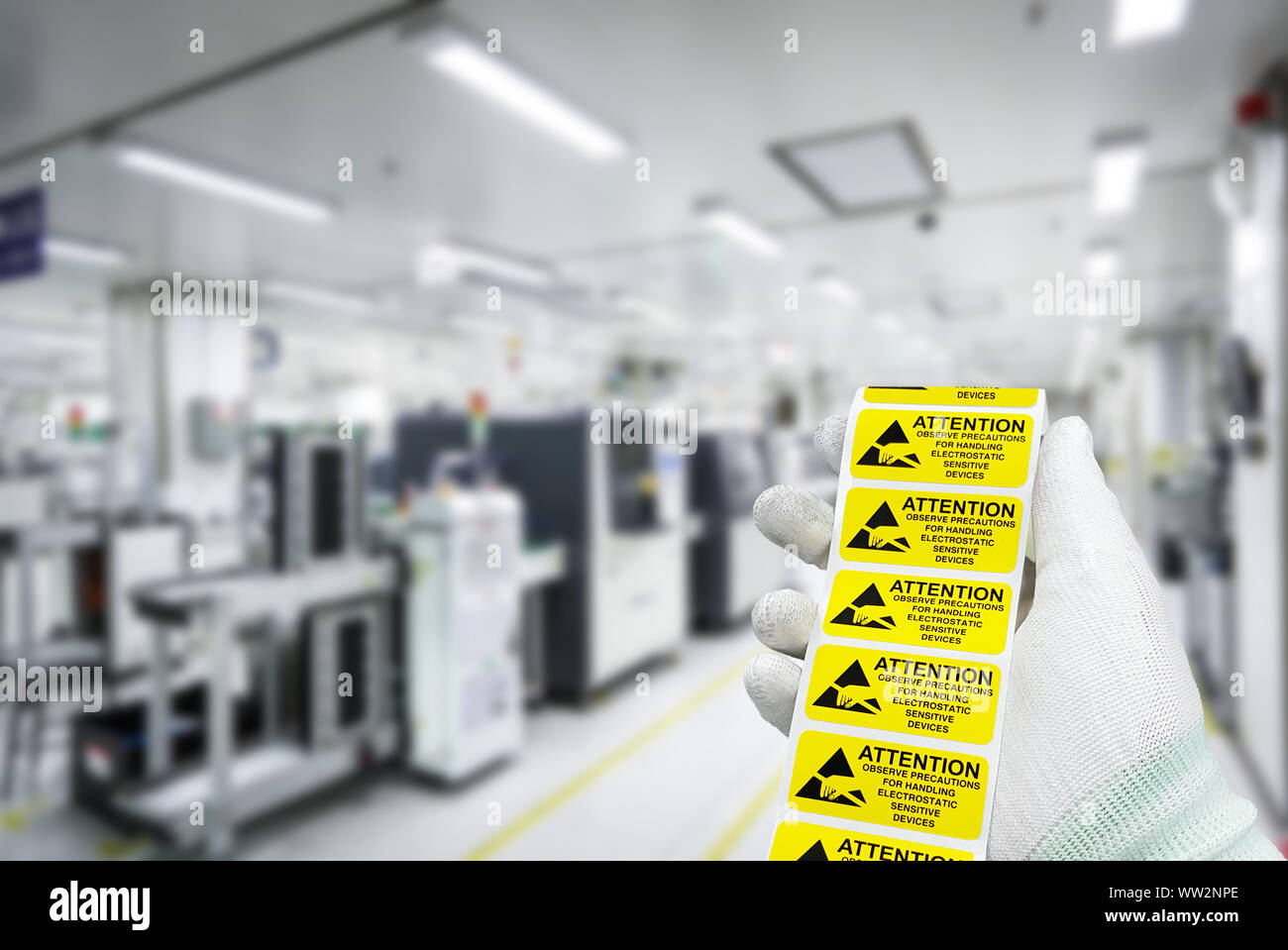 Hand holding "CAUTION Electrostatic Sensitive Devices" label at static ...
