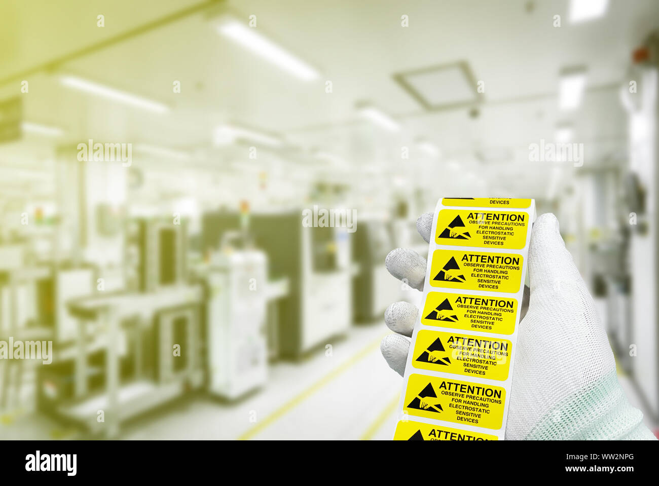 Hand holding "CAUTION Electrostatic Sensitive Devices" label at static ...
