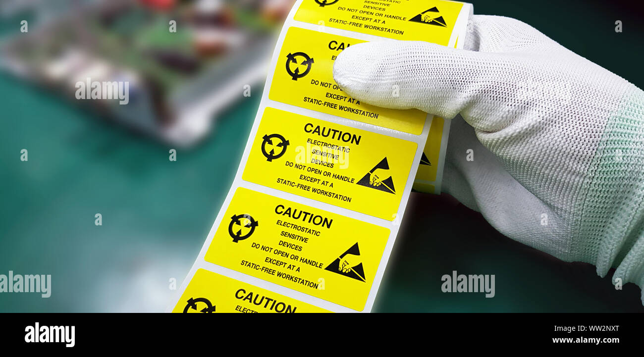 Hand holding ESD symbol label with antistatic gloves,Electrostatic ...