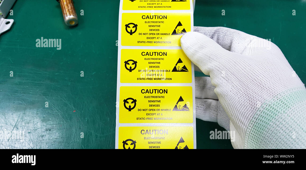 Hand holding ESD symbol label with antistatic gloves,Electrostatic ...