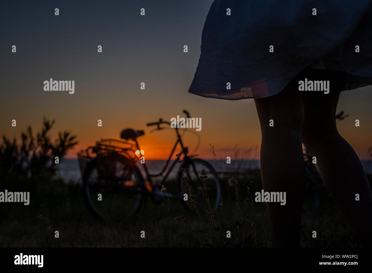 Woman standing on landscape Stock Photo - Alamy