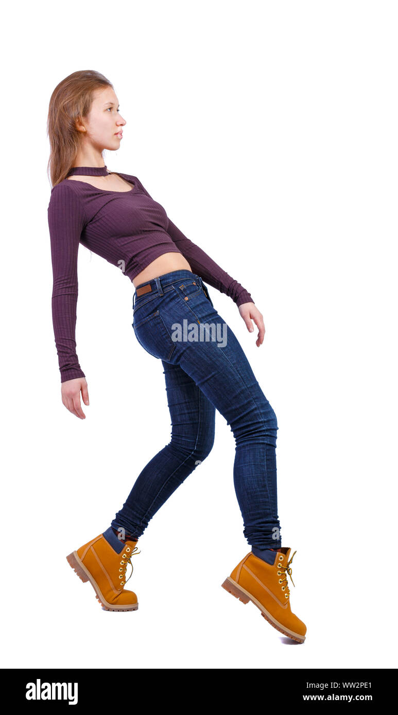 Side view of a woman dancing ballet. girl is balancing. Rear view ...