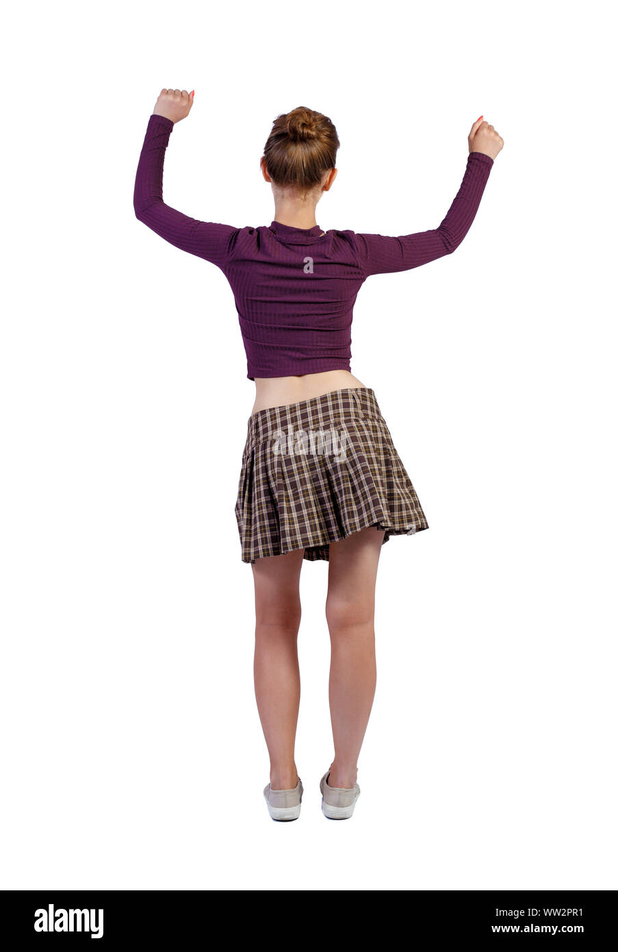 back view of dancing young beautiful woman. girl watching. Rear view ...