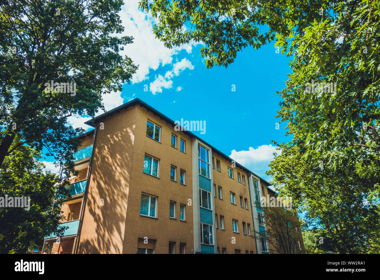 Town berlin wall facade yellow blue hi-res stock photography and images ...