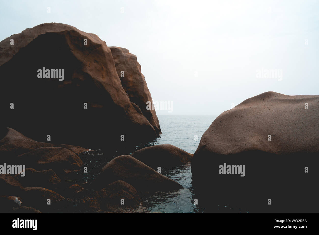 rocks in the ocean at italian coastline Stock Photo - Alamy