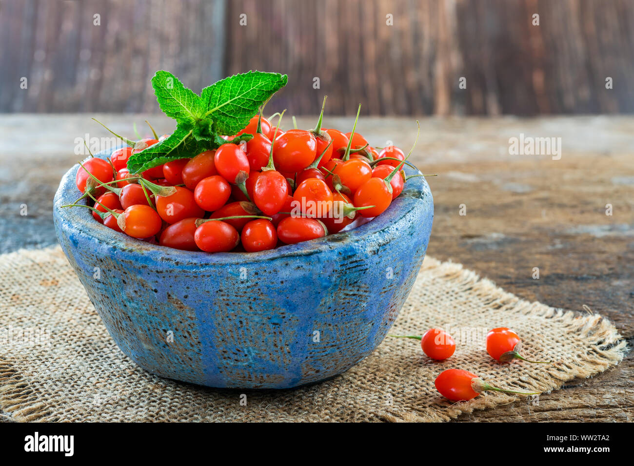 Fresh goji berries in a bowl - closeup Stock Photo - Alamy