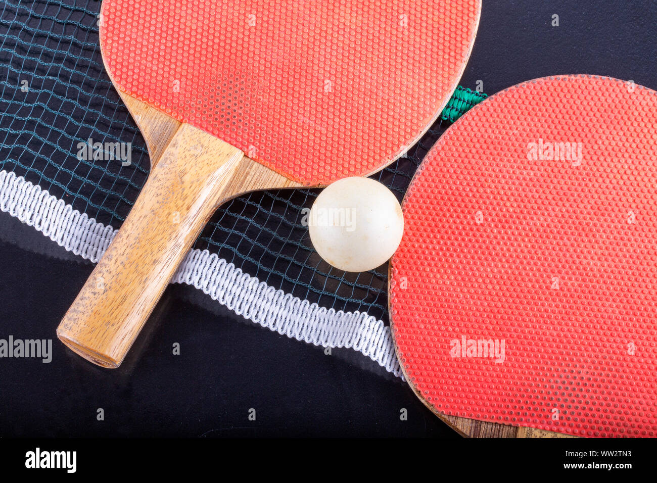 Ping pong rackets with ball and net, close up, horizontal image Stock ...