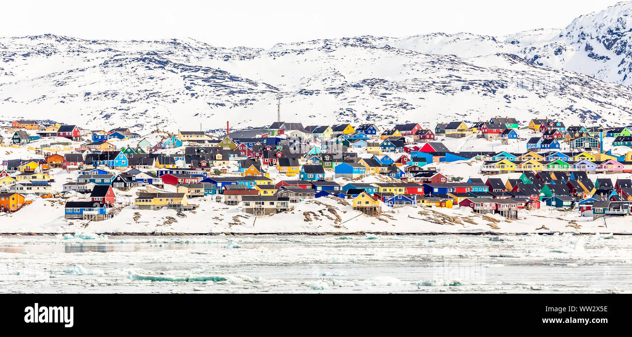 Arctic city center panorama with colorful Inuit houses on the rocky ...
