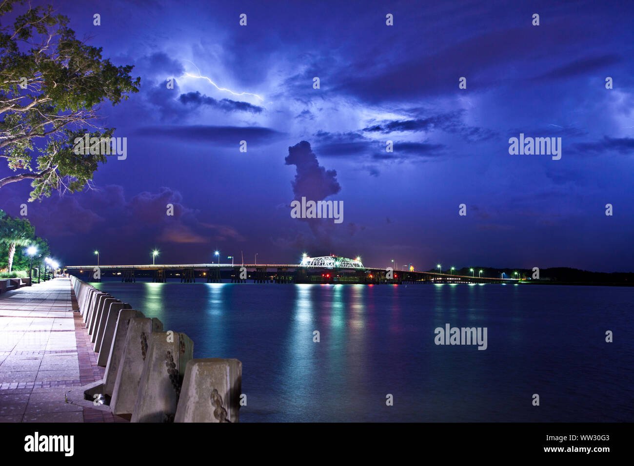 lightning and stormy weather over water at night Stock Photo - Alamy
