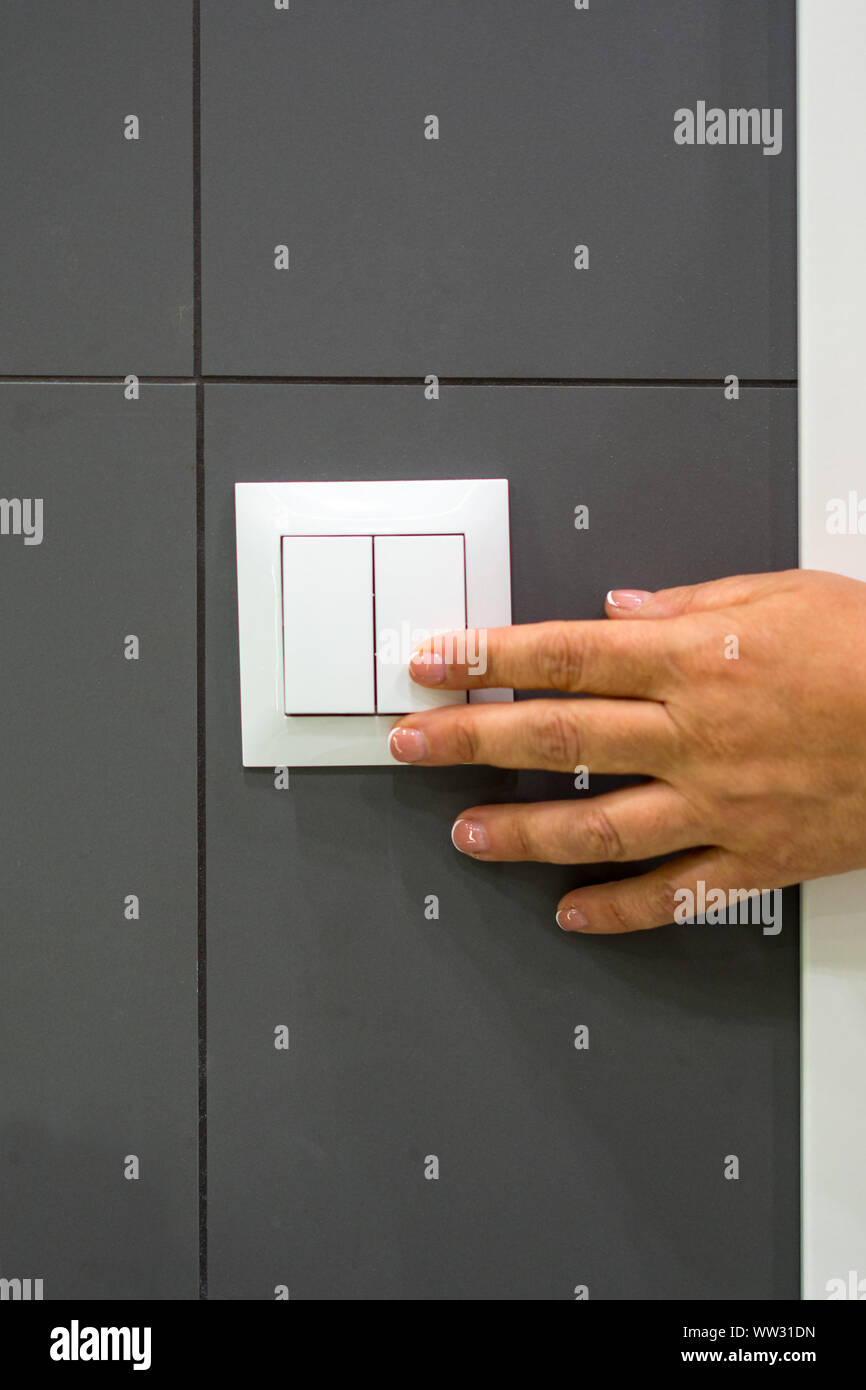 Woman turn off switch light hi-res stock photography and images - Alamy