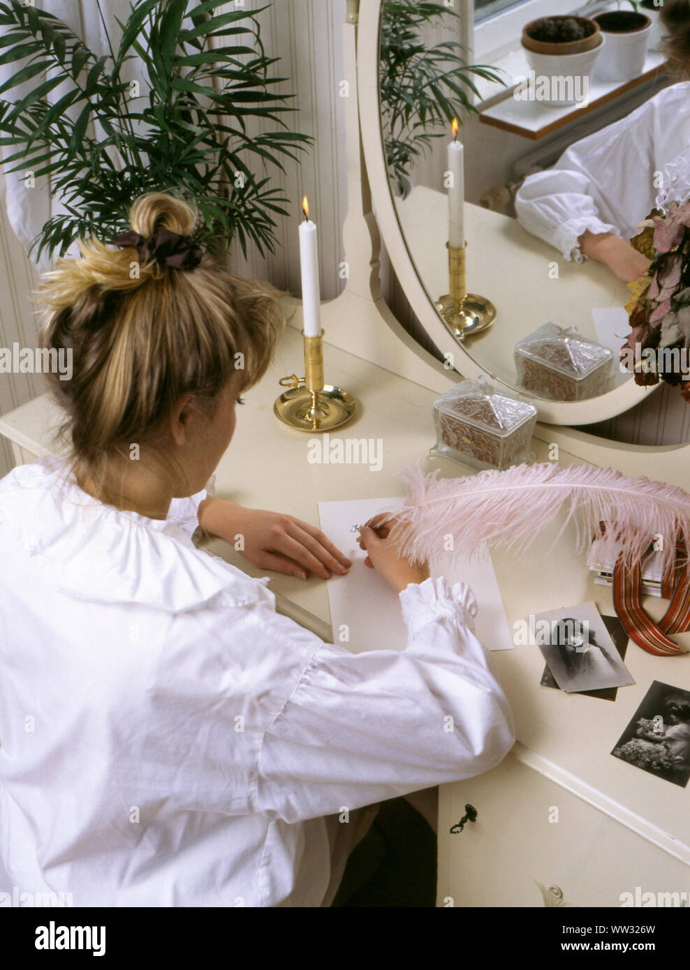 Woman writing letter with quill Stock Photo - Alamy