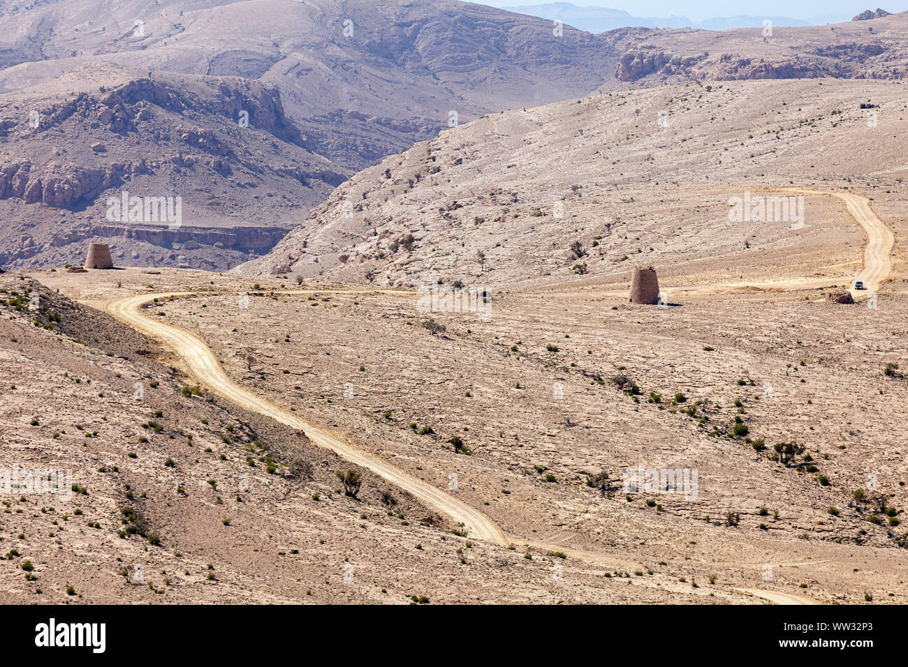 Ancient beehive stone tombs in the mountains in the desert, Jabal Bani ...