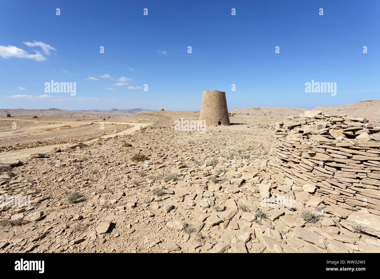 Ancient beehive stone tombs in the mountains in the desert, Jabal Bani ...