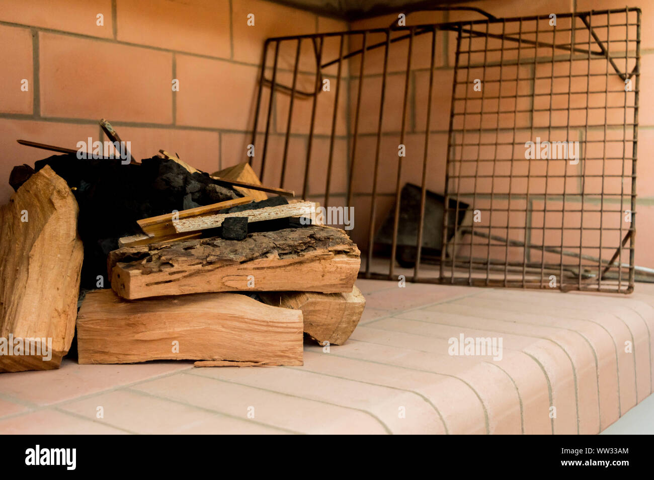 Firewood and coal on a grill to make fire Stock Photo - Alamy