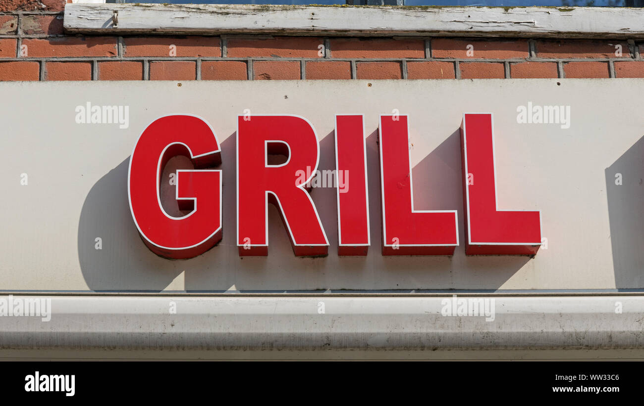 Big Red Letters Grill Sign at Restaurant Wall Stock Photo - Alamy