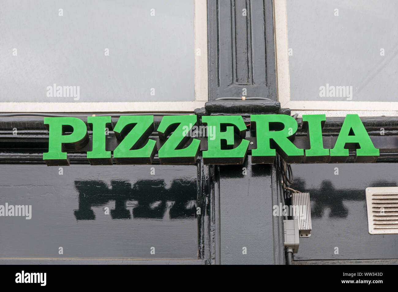 Big Green Letters Pizzeria Sign Building Exterior Stock Photo - Alamy