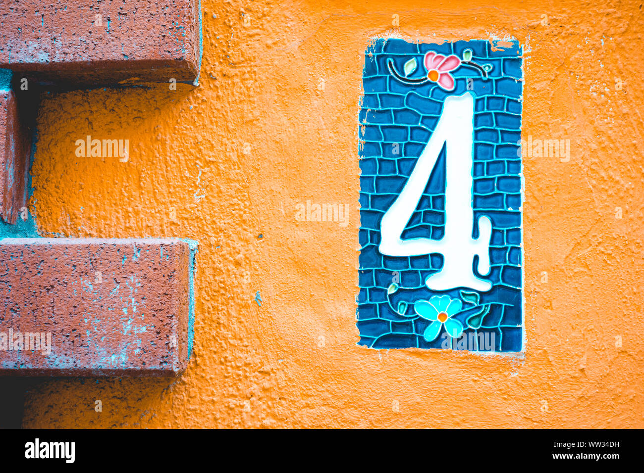 number 4 door sign on orange background Stock Photo - Alamy