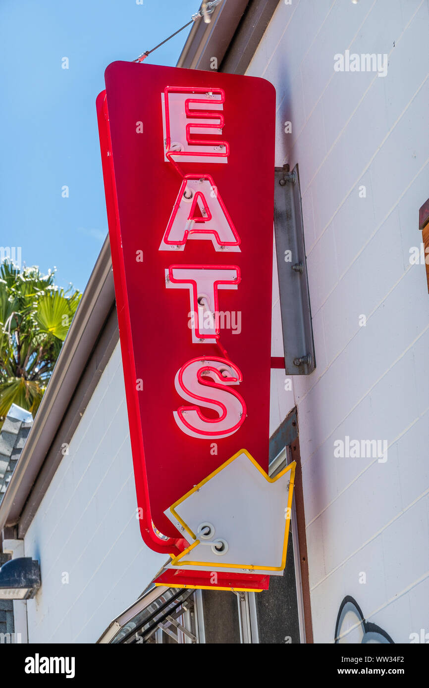 Eats neon sign with arrow pointing down at Industrial Eats restaurant ...