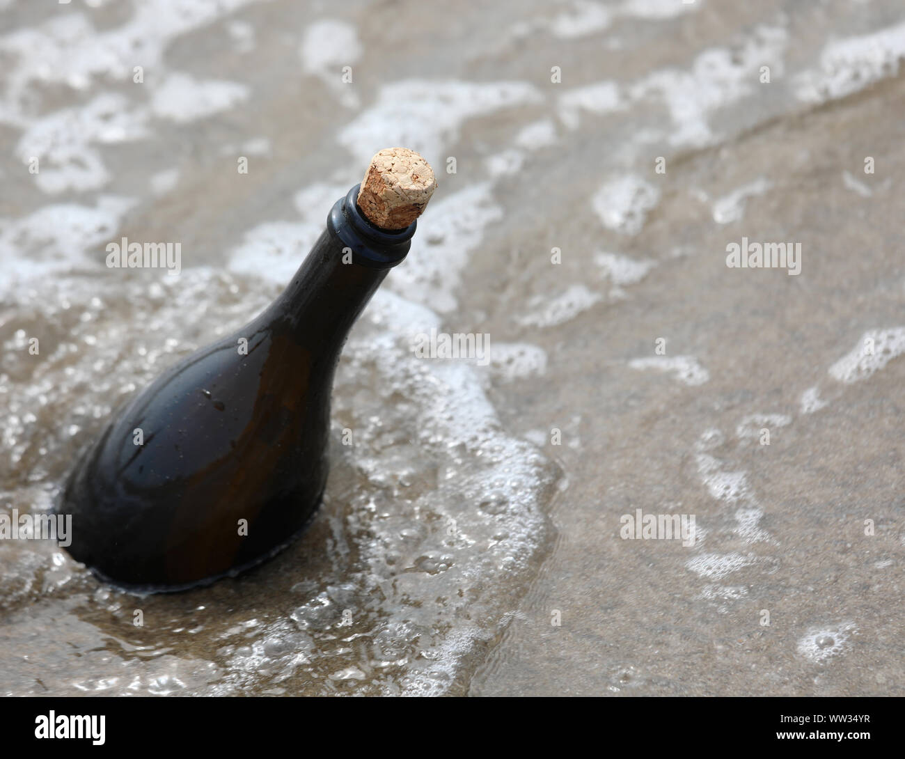 beached bottle with secret message inside Stock Photo - Alamy