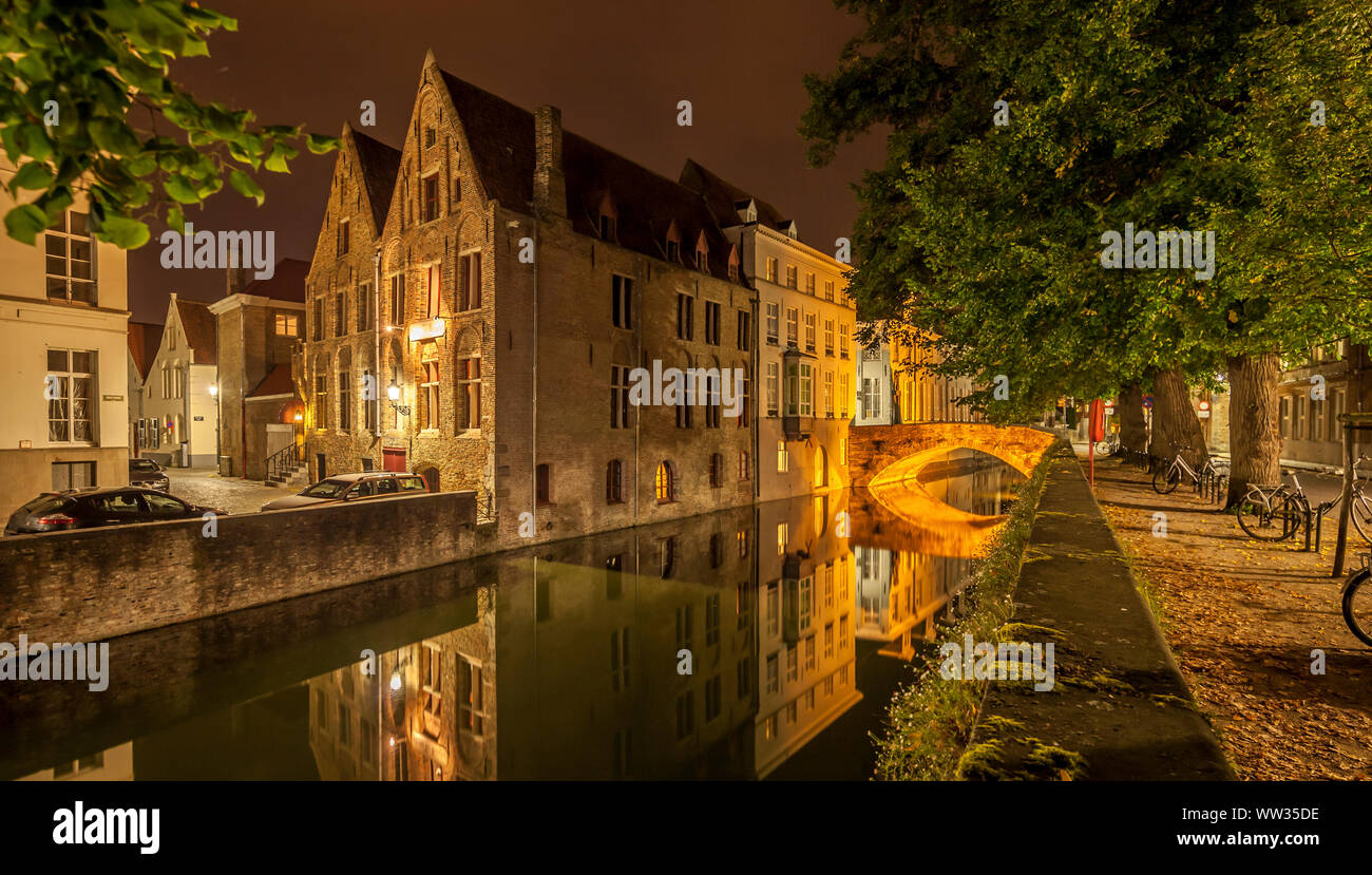 Romantic nocturnal view of a canal in Bruges. Night view of famous ...