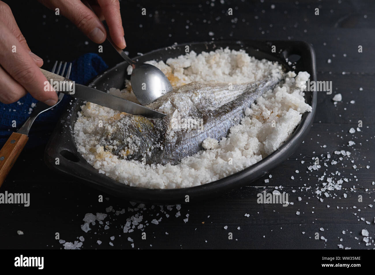Be salt bream. Uncovering is fish after baking Stock Photo - Alamy
