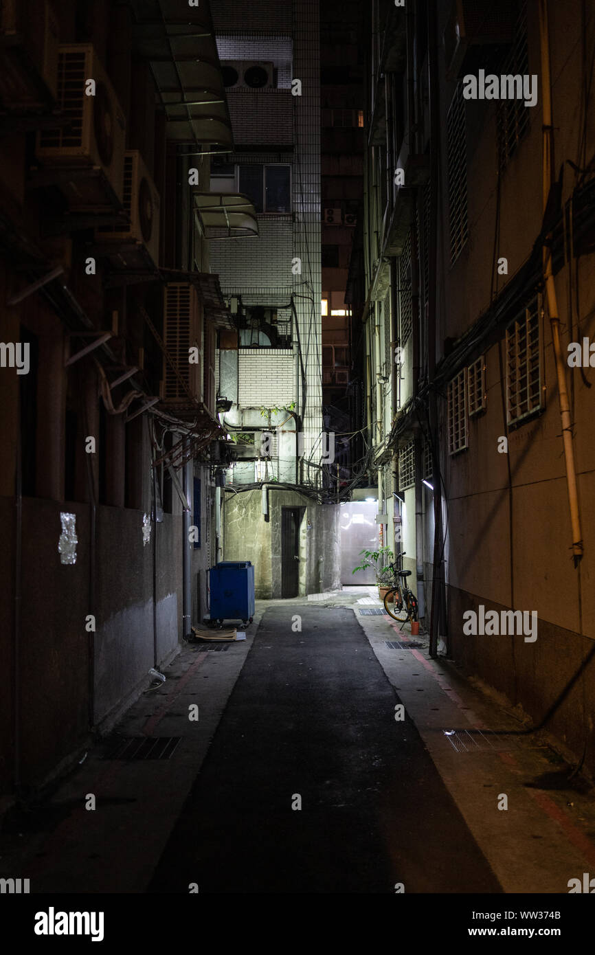 Taipei, Taiwan: Small dark alley in Taipei at night. Very small side ...