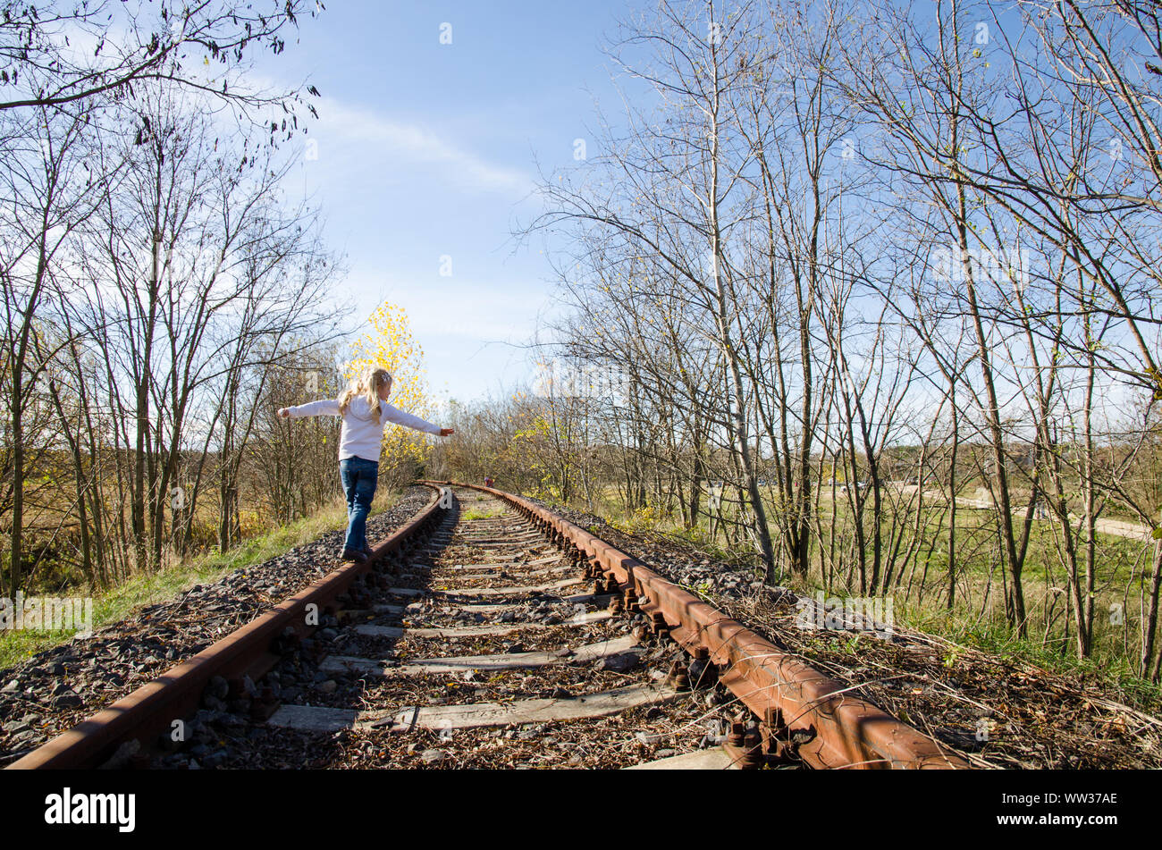 little child walking on railway Stock Photo - Alamy