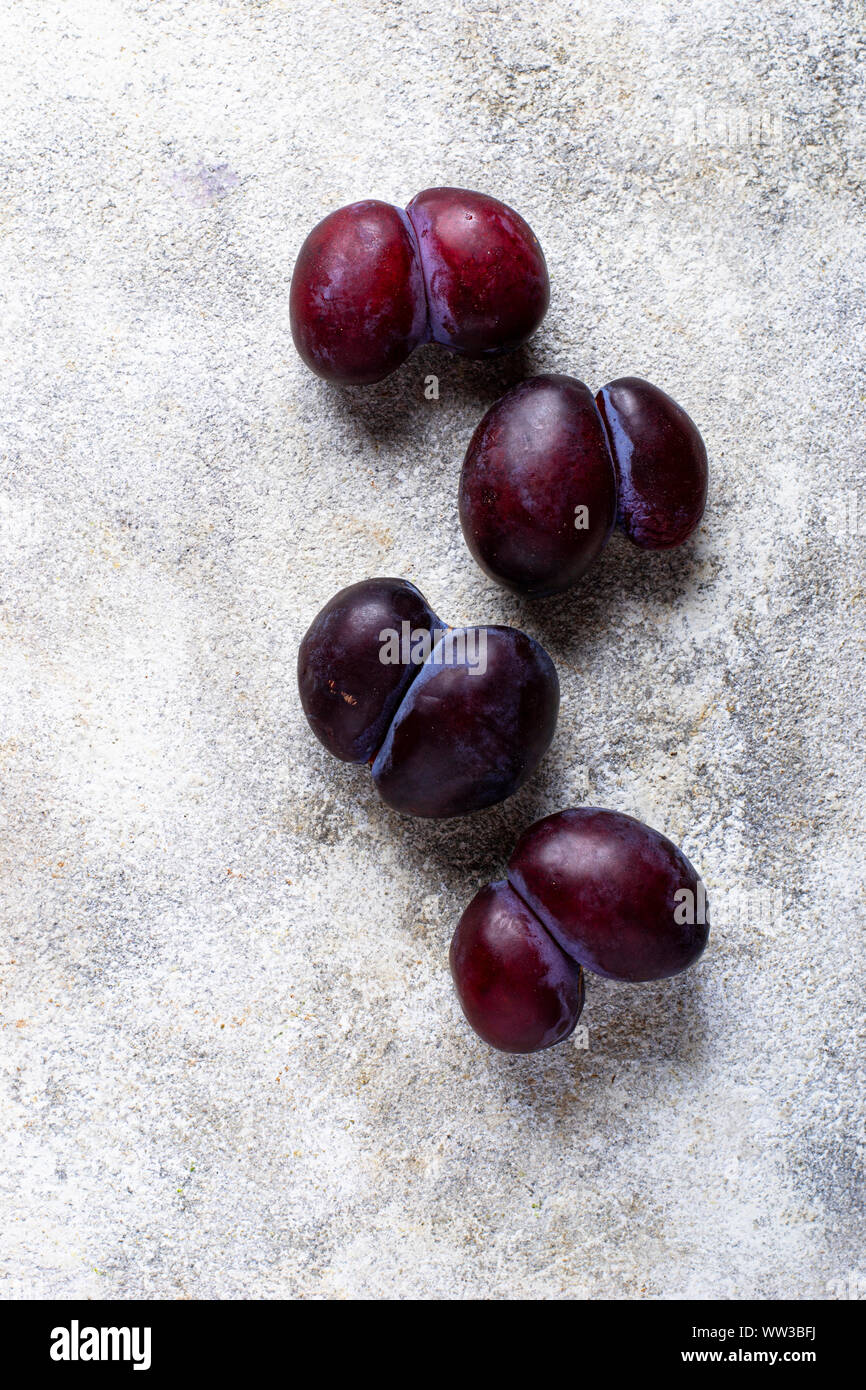 Ugly plums. Abnormal organic fruit Stock Photo - Alamy