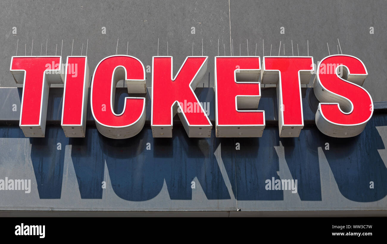 Big Red Letters Tickets Sign at Building Wall Stock Photo - Alamy