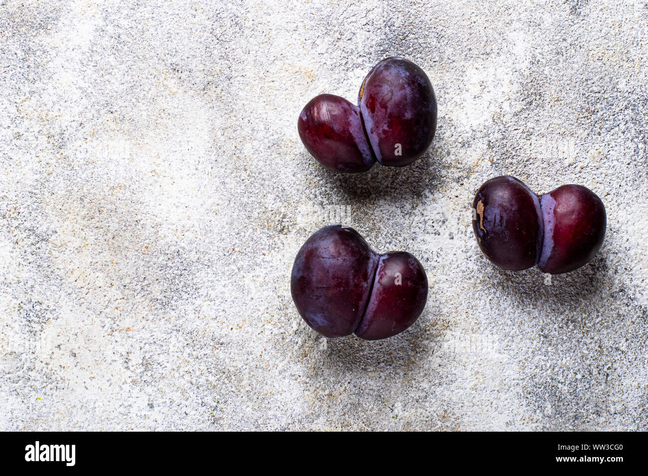 Ugly plums. Abnormal organic fruit Stock Photo - Alamy