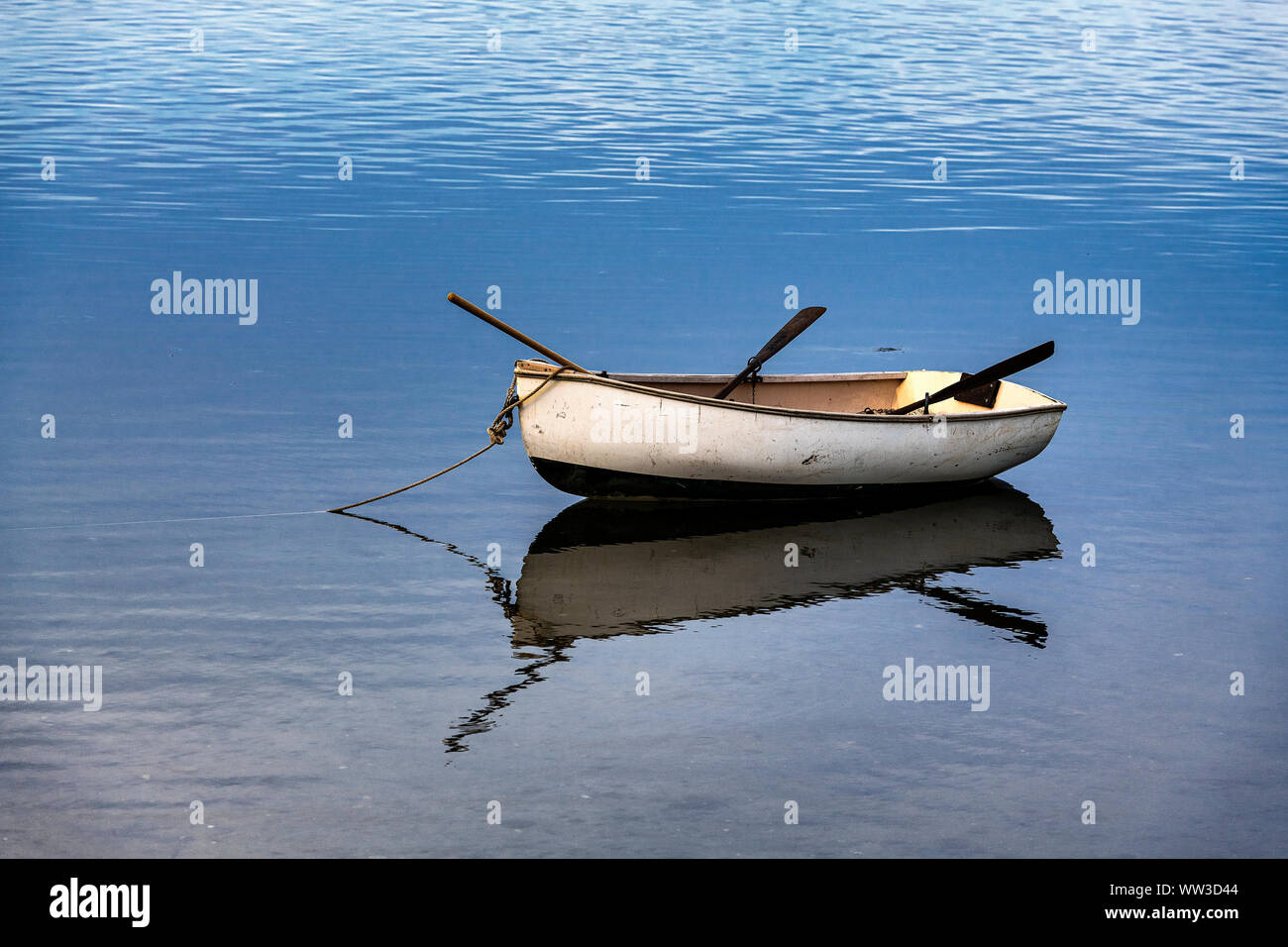 Rowboat anchored in shallow water, Chatham, Cape Cod, Massachusetts ...