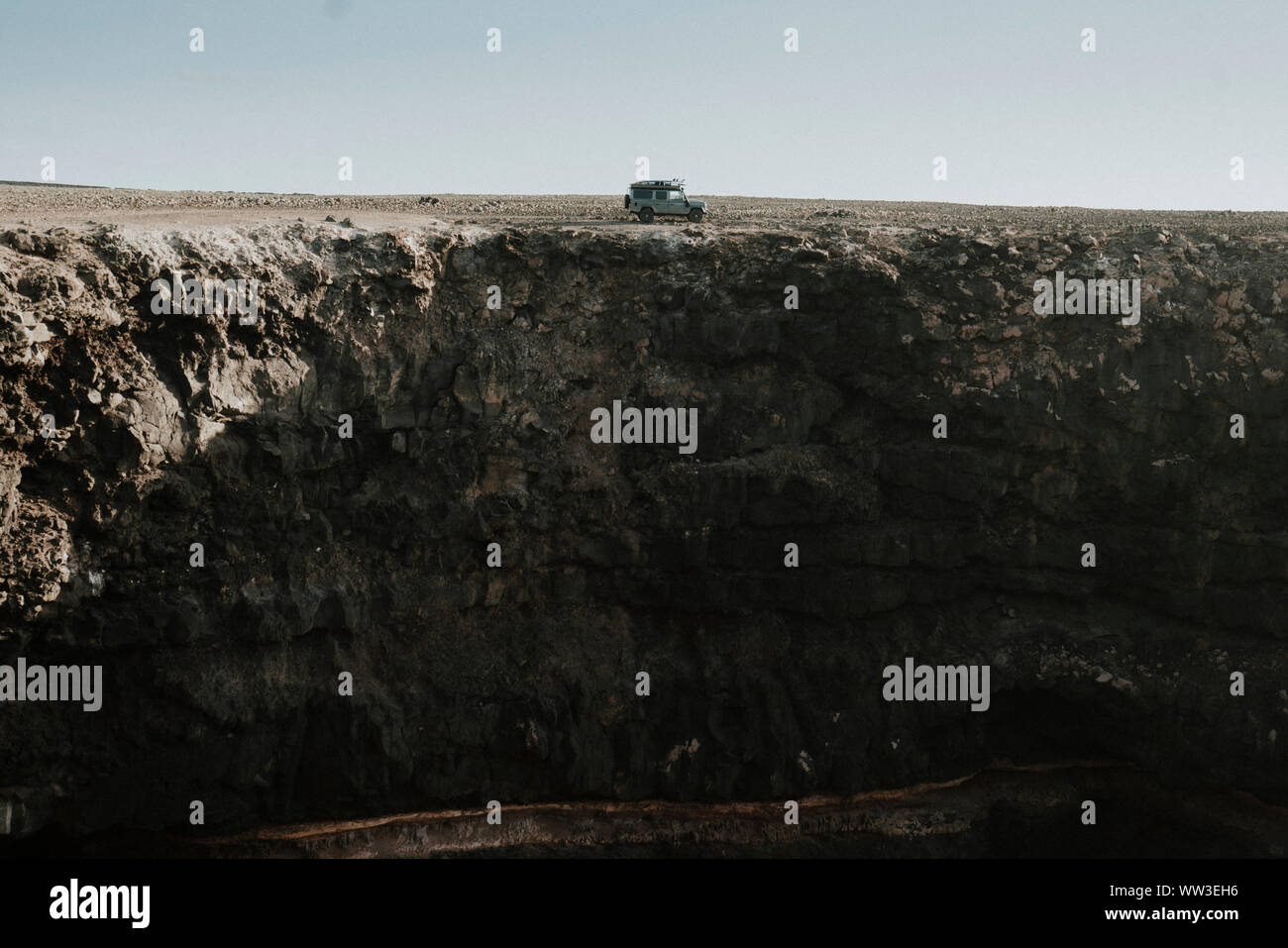 Overland adventure while driving a 4x4 close to the cliff Stock Photo ...